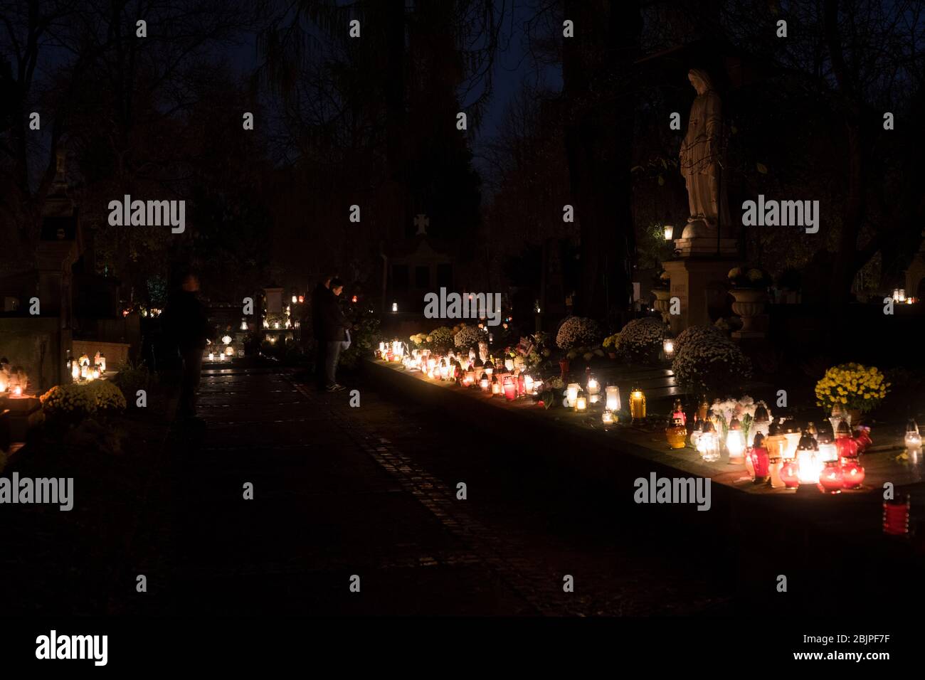 People remember their deceased loved ones at Rakowicki Cemetery in ...