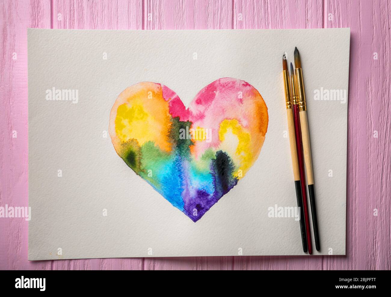 Watercolor painting of rainbow heart on wooden background Stock Photo ...