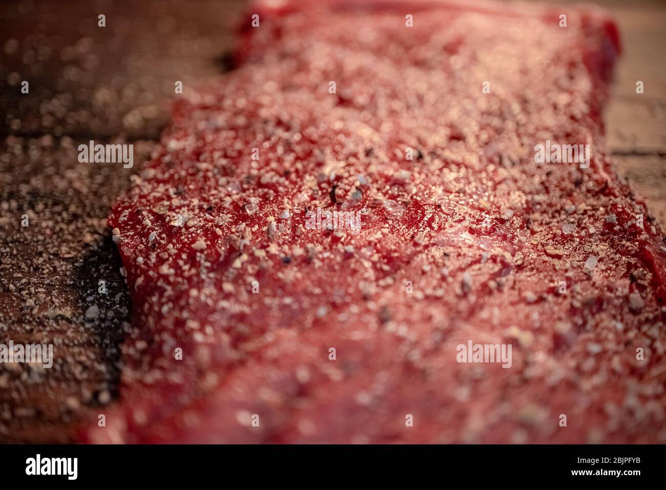 Mixed pepper and spices on the raw meat steak close up Stock Photo - Alamy