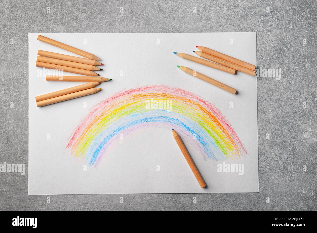 Beautiful drawing of rainbow and color pencils on grey background Stock ...