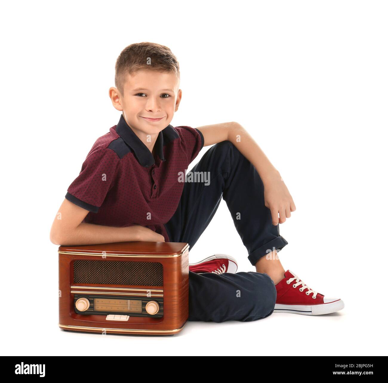 Adorable little boy with vintage radio on white background Stock Photo ...