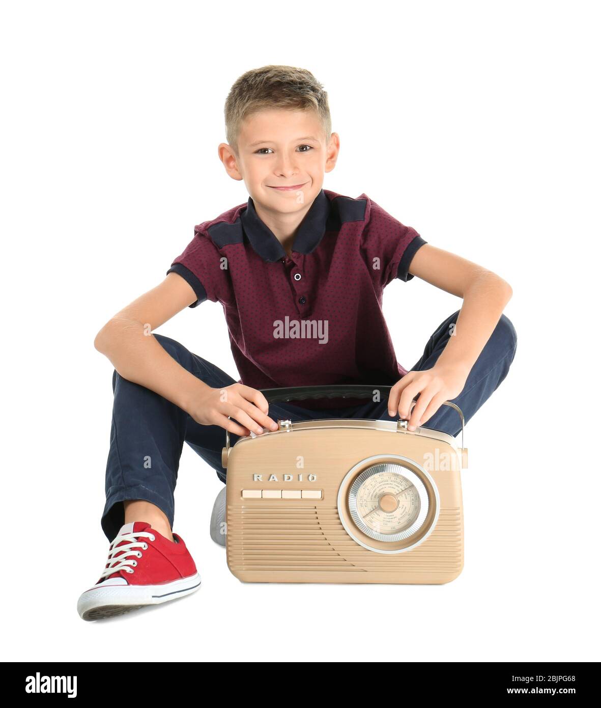 Adorable little boy with vintage radio on white background Stock Photo ...