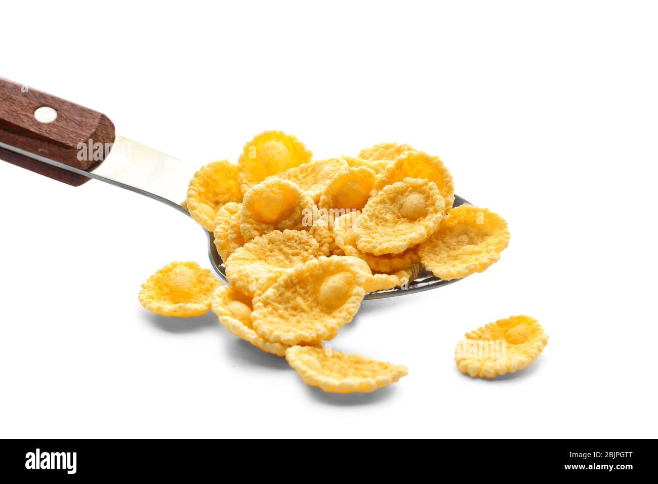 Spoon with tasty corn flakes on white background Stock Photo - Alamy