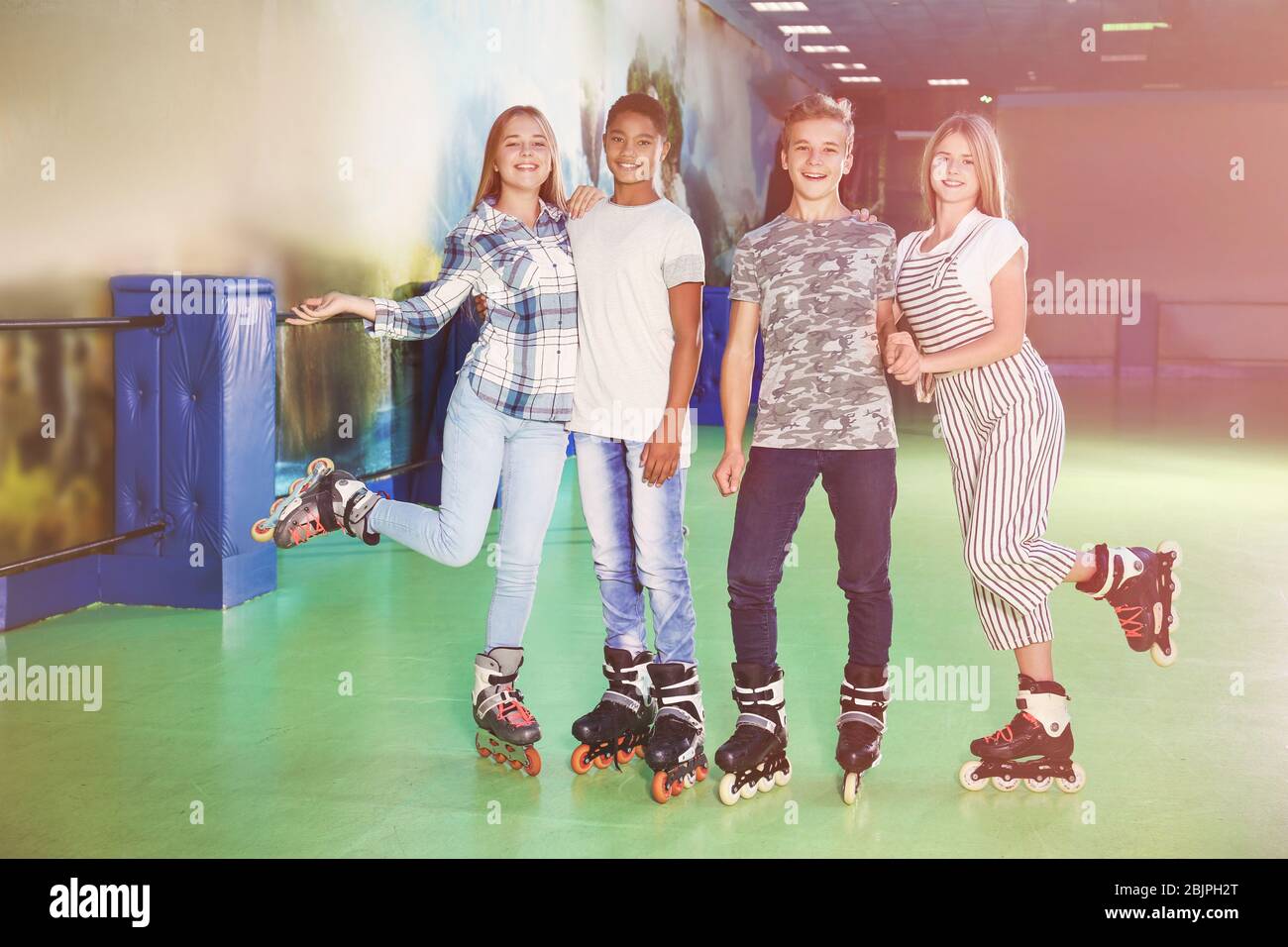 Group of teenagers at roller skating rink Stock Photo - Alamy
