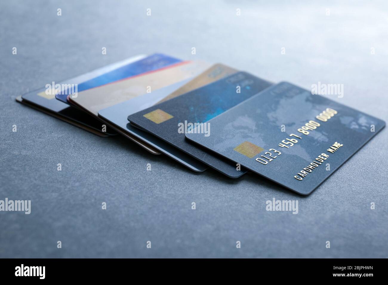 Different credit cards on table Stock Photo - Alamy