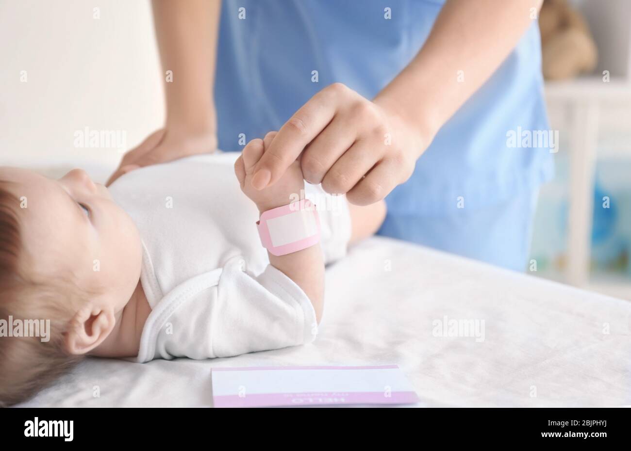 Female doctor with baby at hospital Stock Photo - Alamy