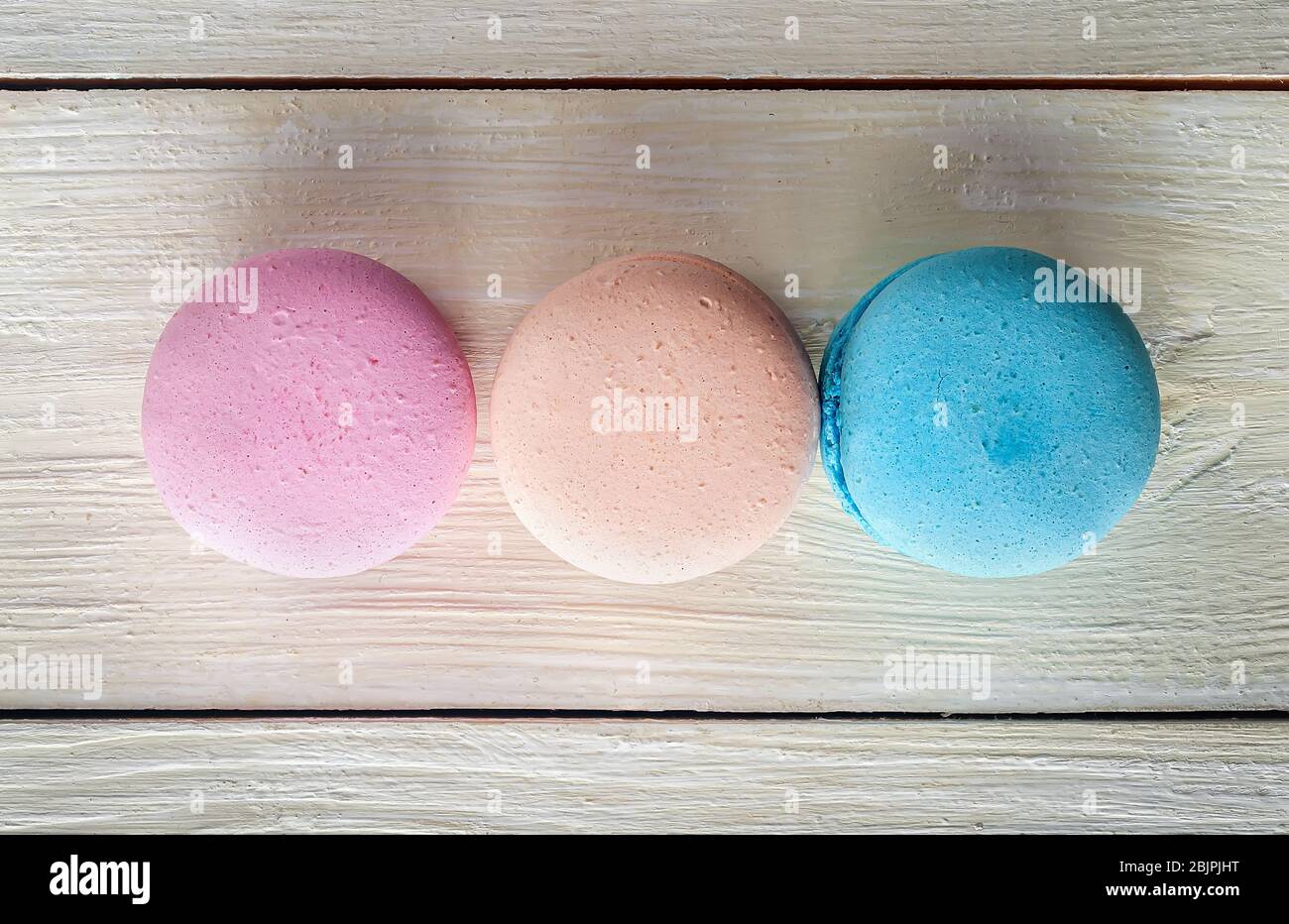 Three macaroons in a row Stock Photo - Alamy