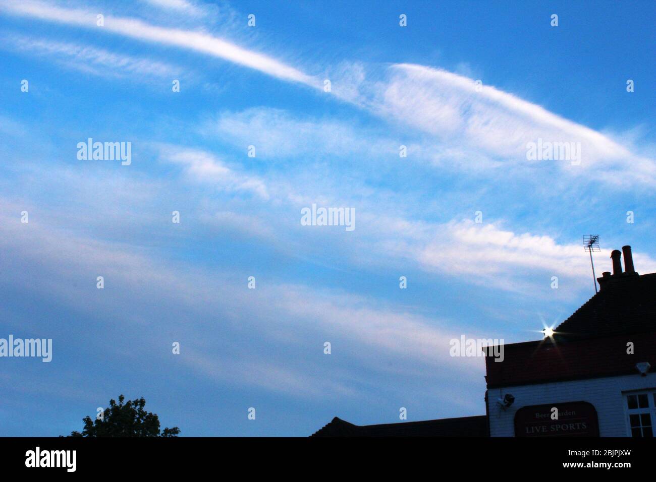 Pale blue sky with clouds hi-res stock photography and images - Alamy