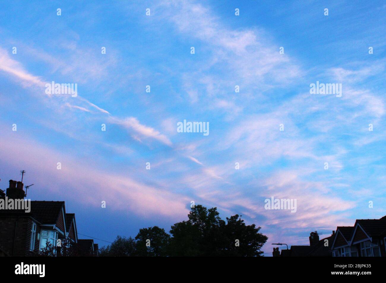 Pale blue sky with clouds hi-res stock photography and images - Alamy