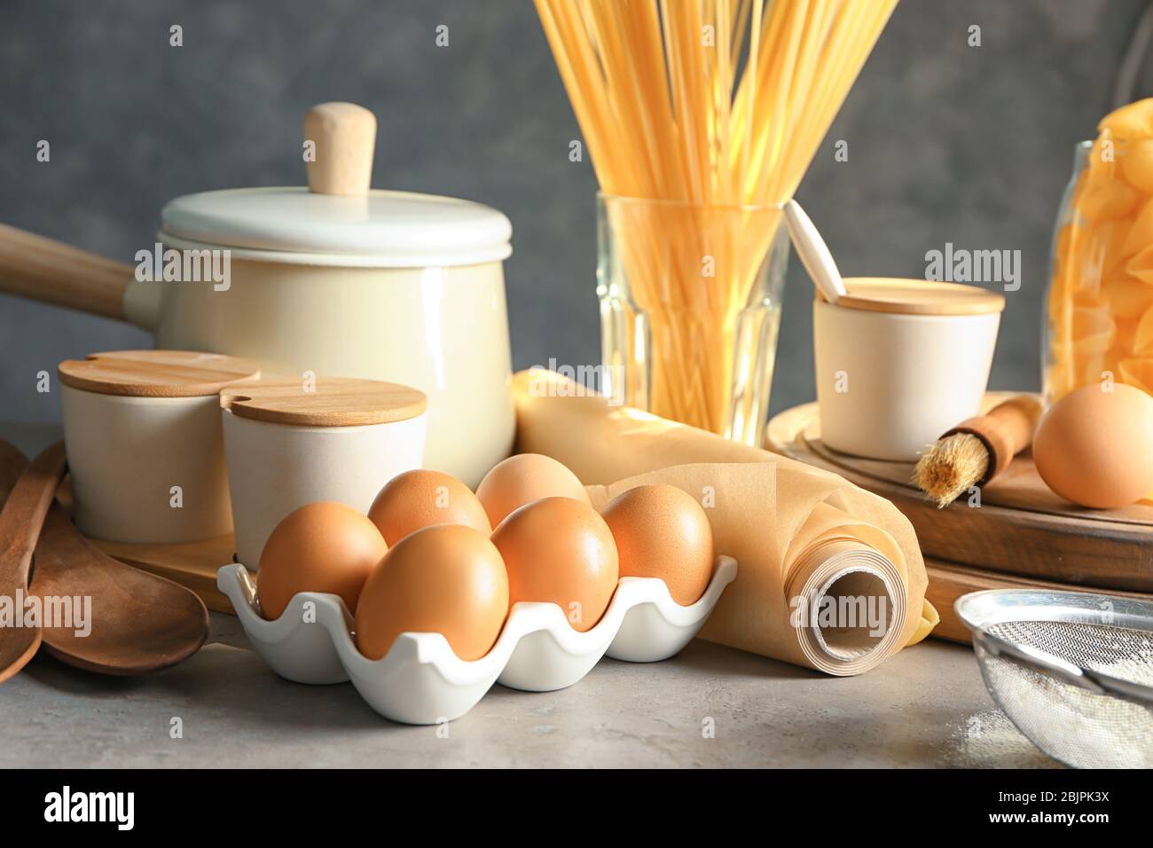 Composition with cooking utensils and ingredients on table Stock Photo ...