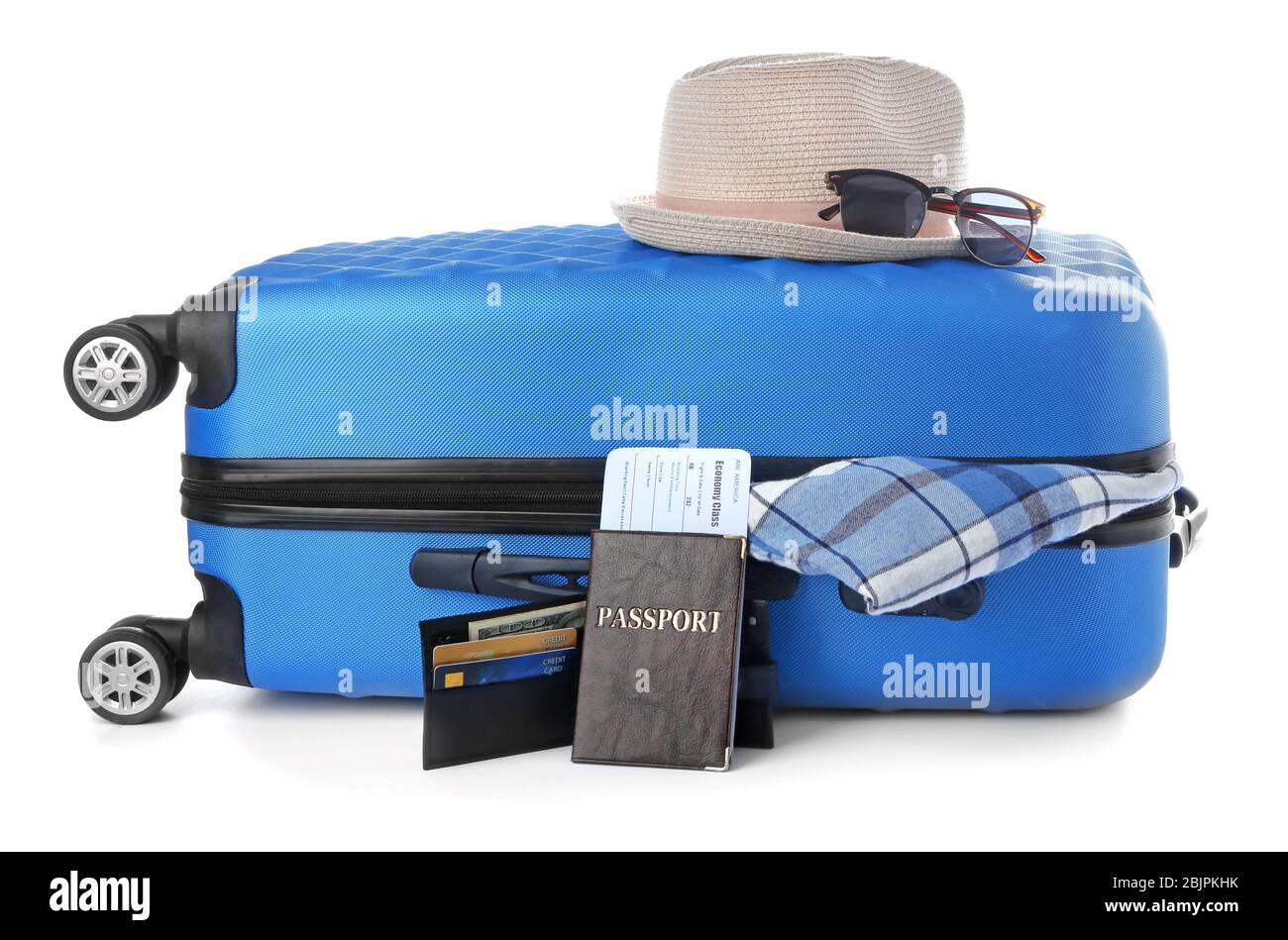 Suitcase and tourist stuff on white background Stock Photo - Alamy