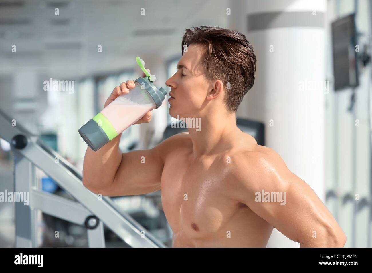 Man drinking protein in gym hi-res stock photography and images - Alamy