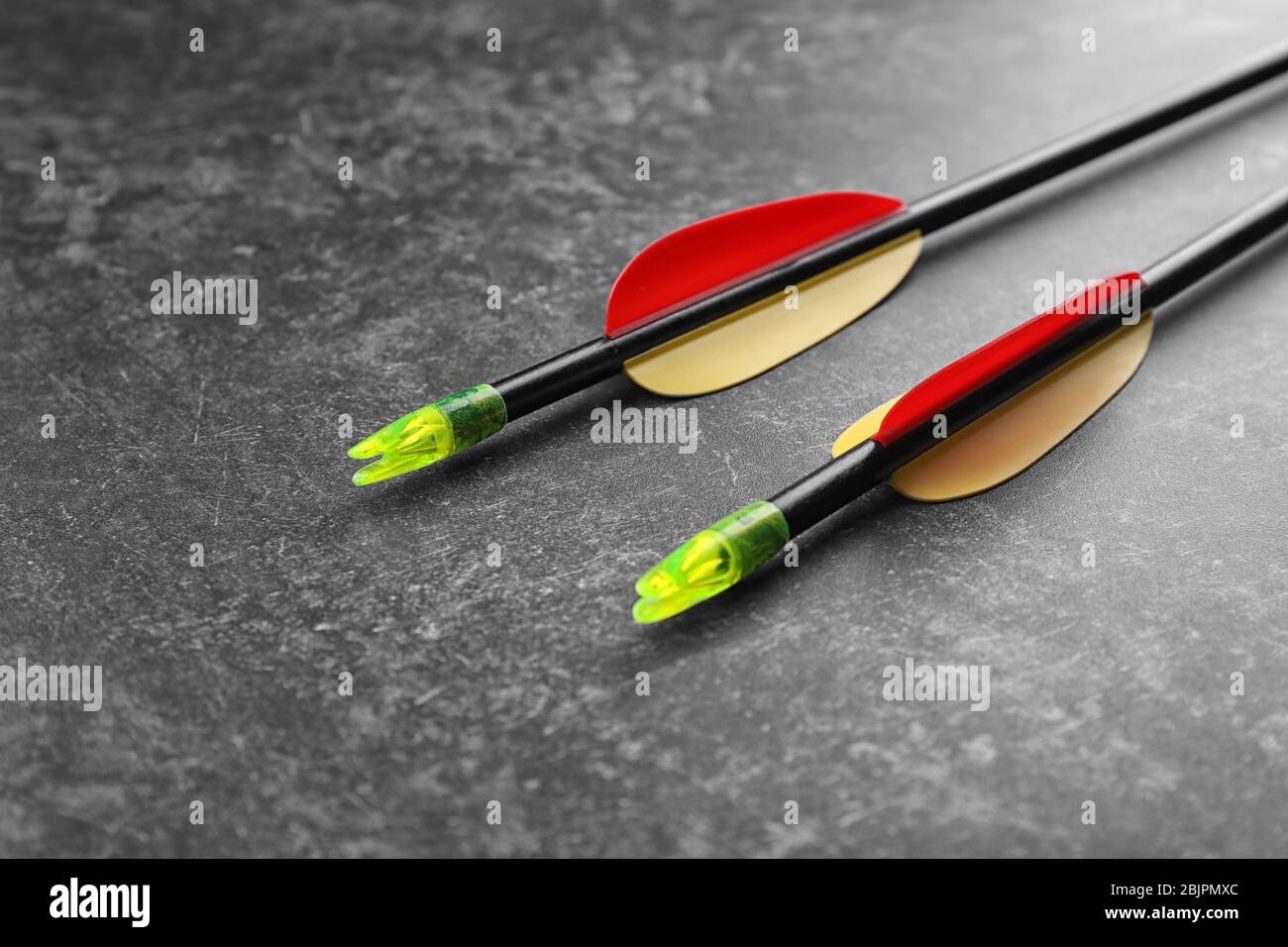 Arrows on table Stock Photo - Alamy