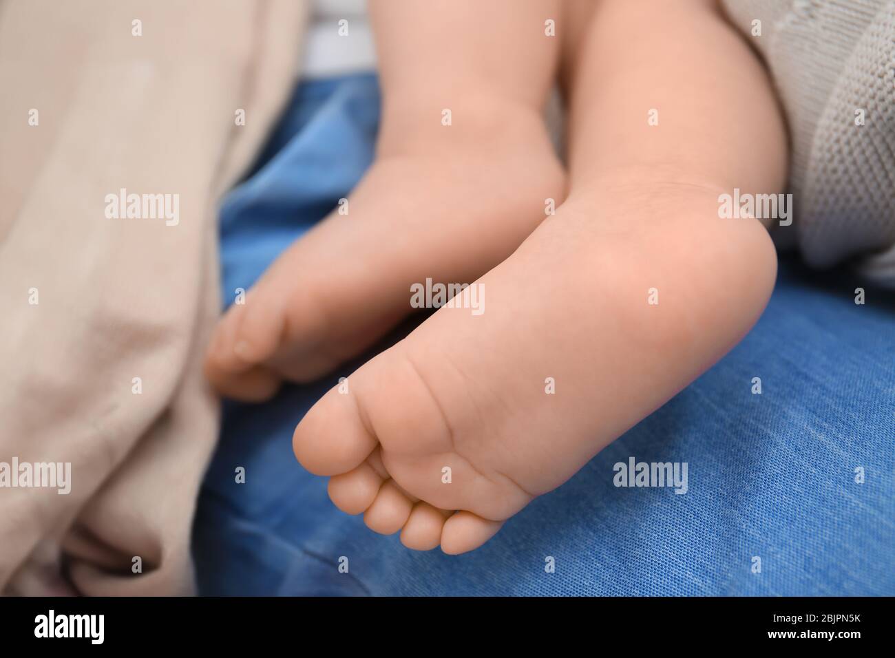 Cute baby feet, closeup Stock Photo - Alamy