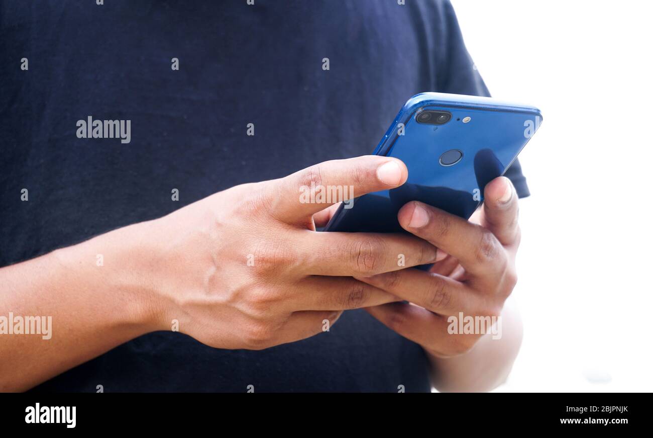 Young Indian man using smartphone Stock Photo - Alamy
