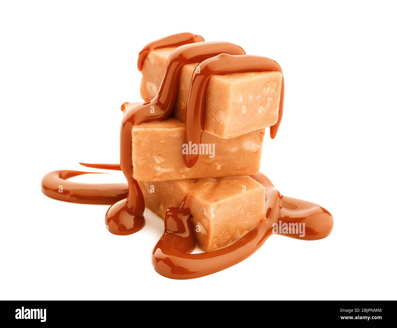 Delicious candies with caramel sauce on white background Stock Photo ...