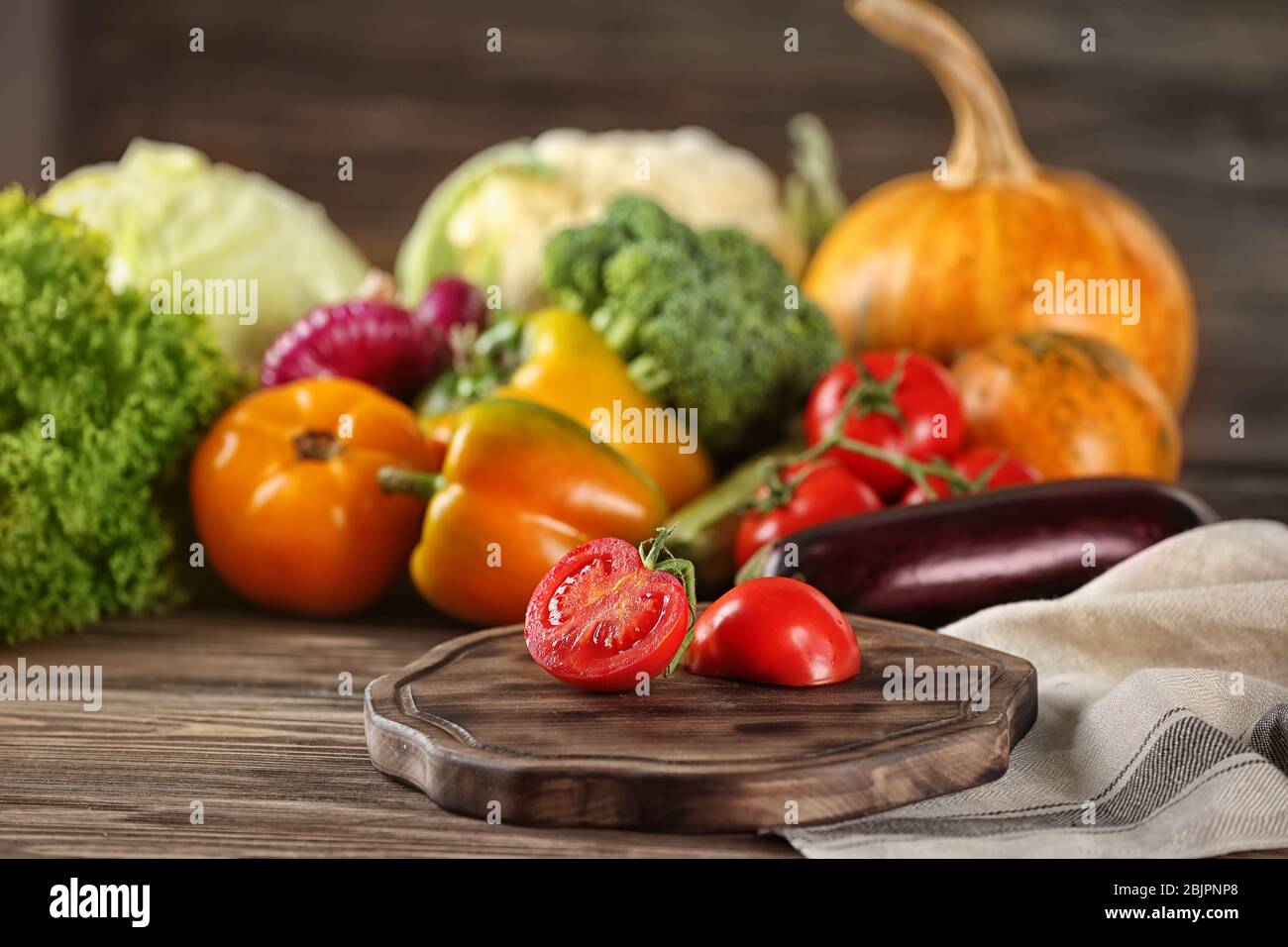 Cut cherry tomato on table Stock Photo - Alamy