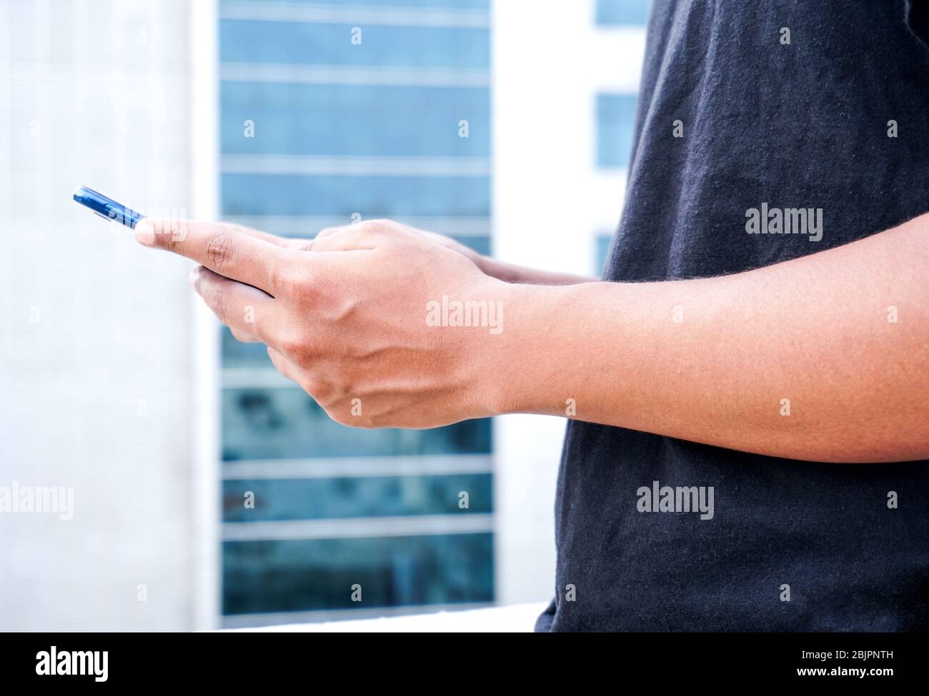 Young Indian man using smartphone Stock Photo - Alamy
