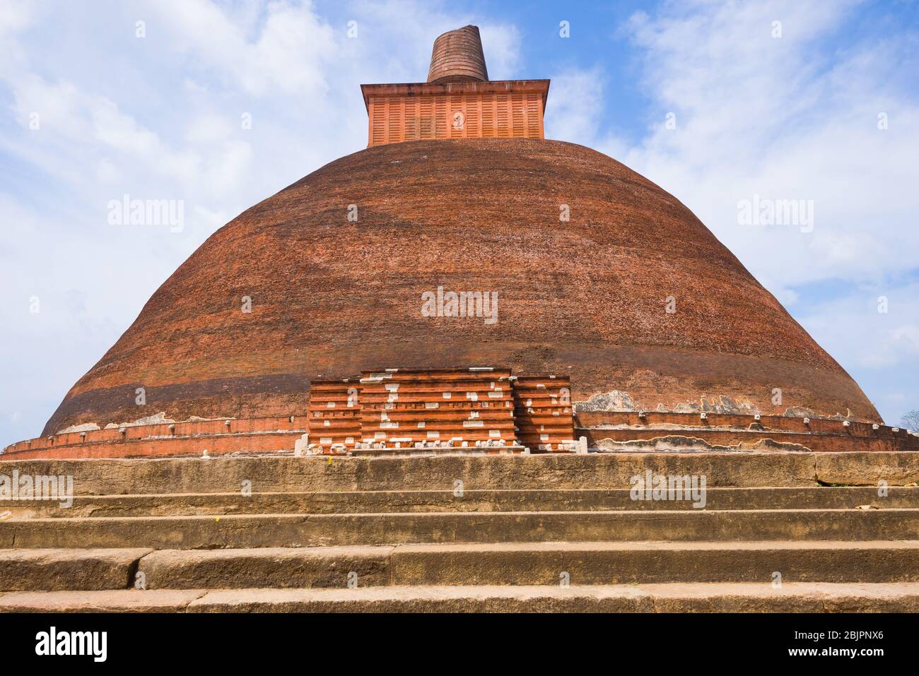 At the foot of the ancient Jethawanaramaya Dagaba on a sunny day ...