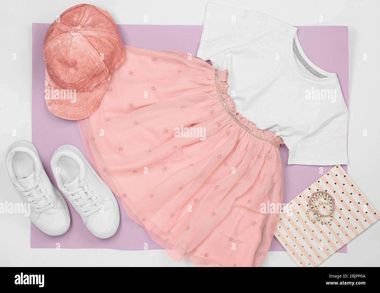 Set of child's clothes on color background Stock Photo - Alamy