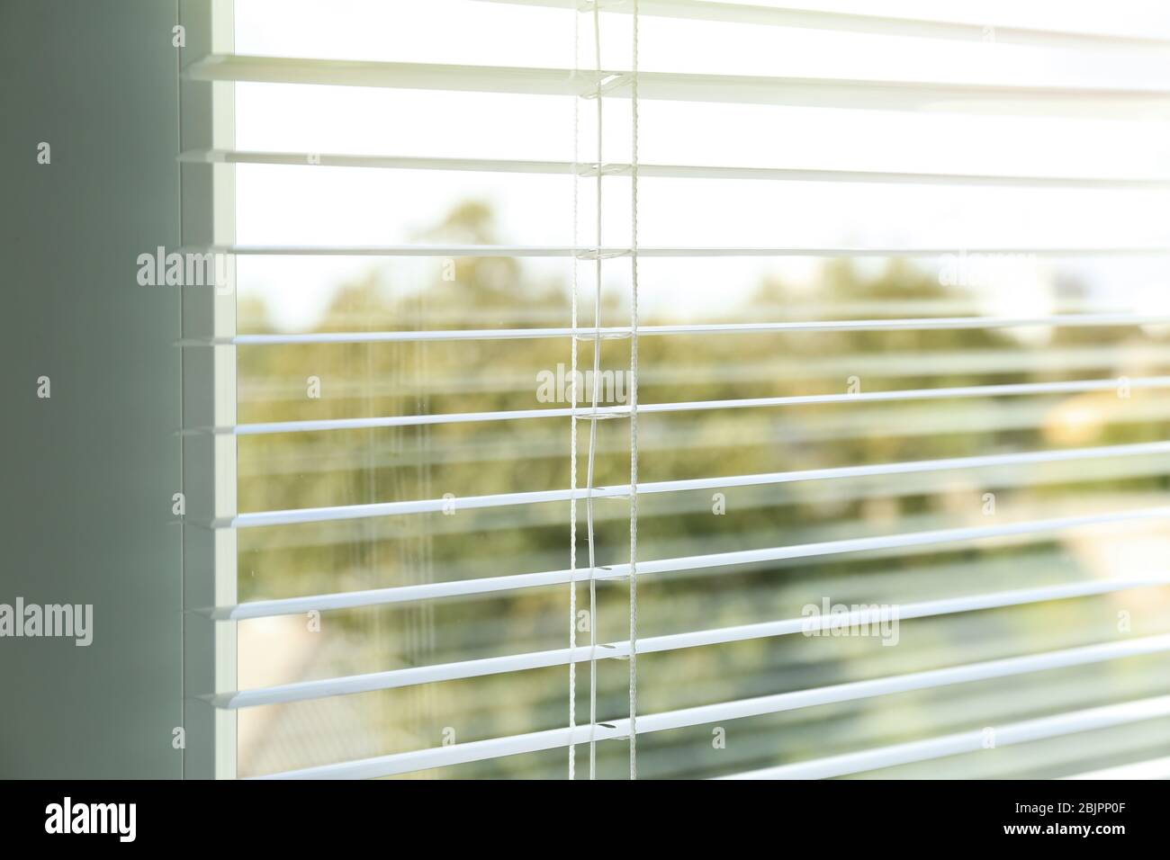 View of white window shutters Stock Photo - Alamy