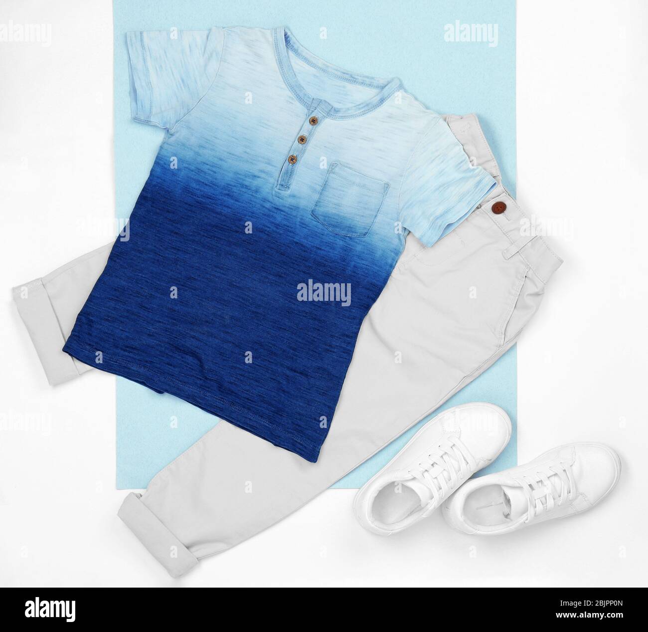 Set of child's clothes on color background Stock Photo - Alamy