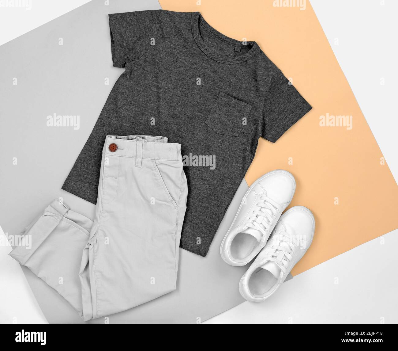 Set of child's clothes on color background Stock Photo - Alamy