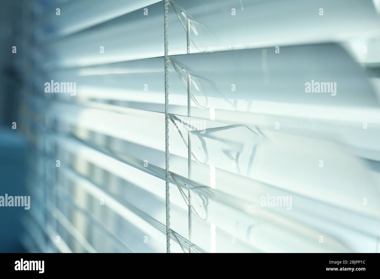 View of white window shutters Stock Photo - Alamy