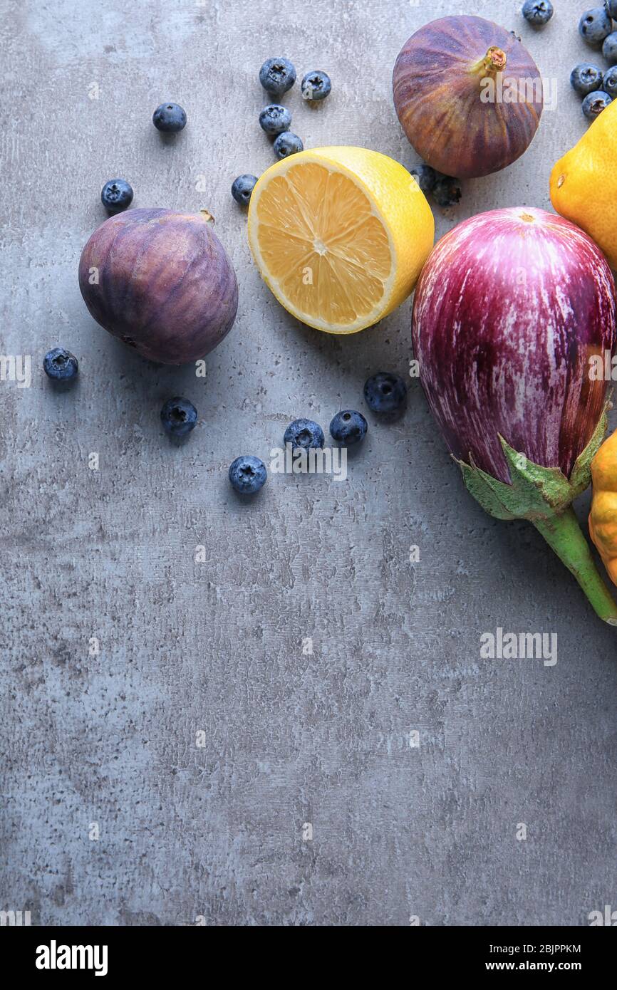 Composition of different fruits and vegetables on grey background Stock ...