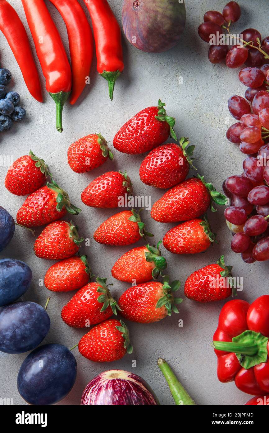 Composition of different fruits and vegetables on grey background Stock ...