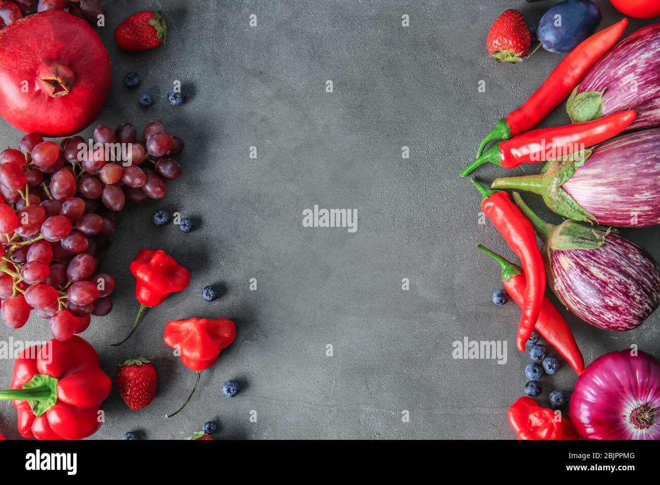 Composition of different fruits and vegetables on grey background Stock ...