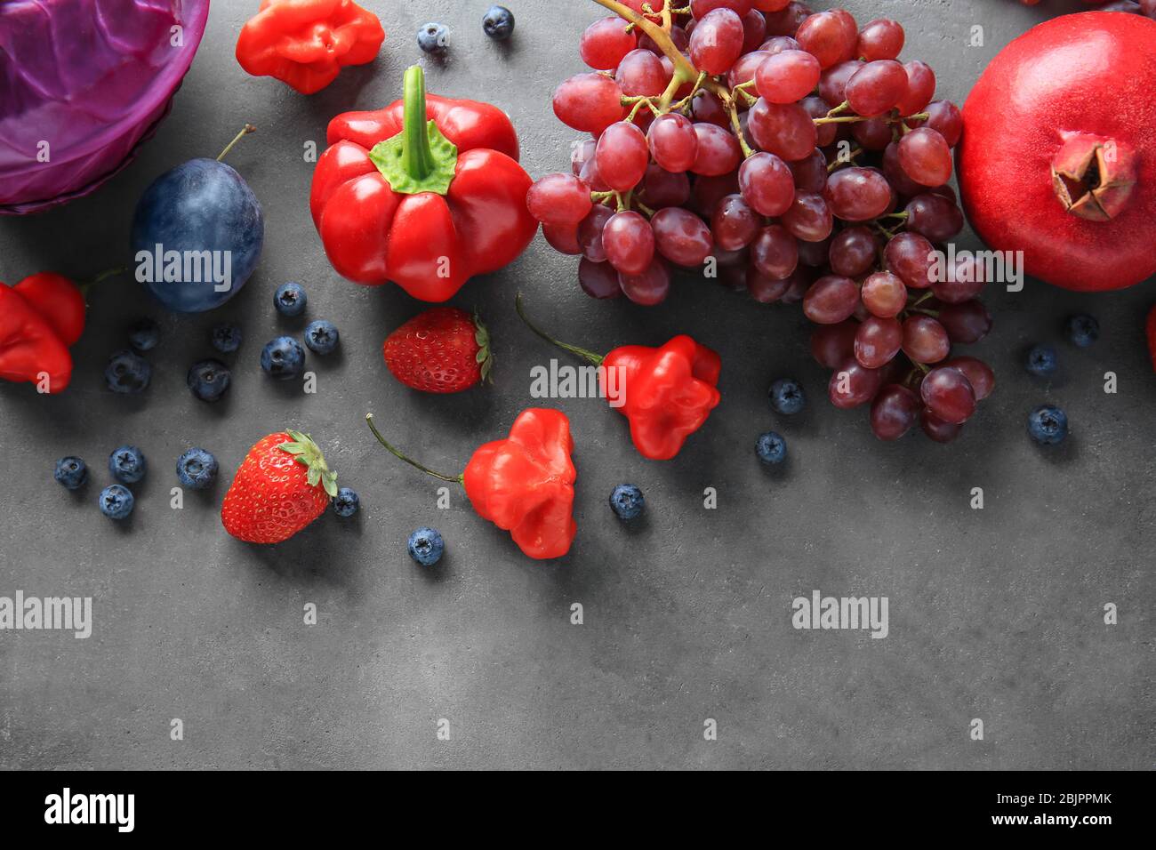 Composition of different fruits and vegetables on grey background Stock ...