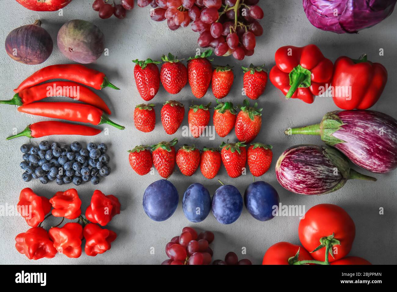 Composition of different fruits and vegetables on grey background Stock ...