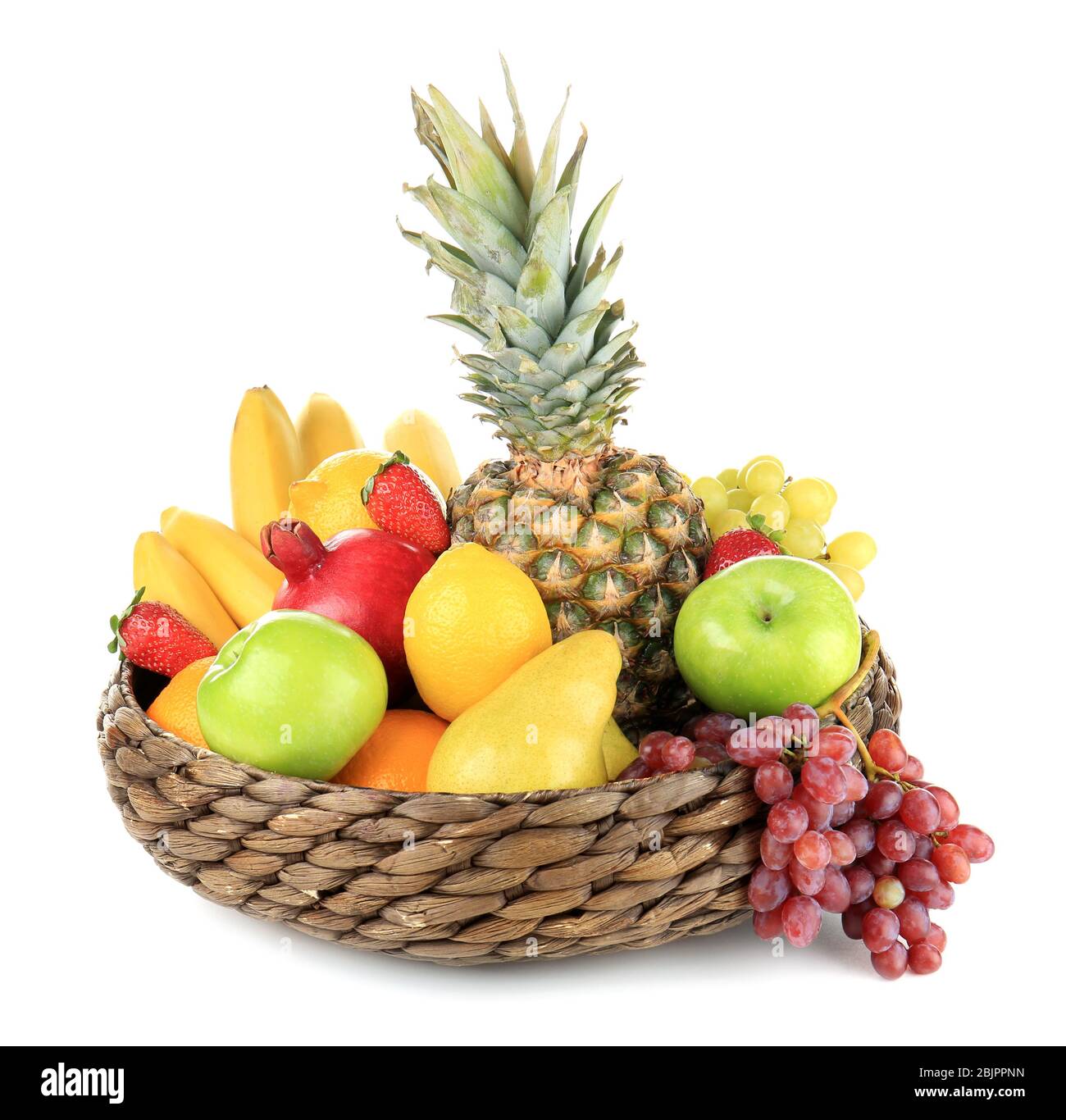 Wicker basket with different fruits on white background Stock Photo - Alamy