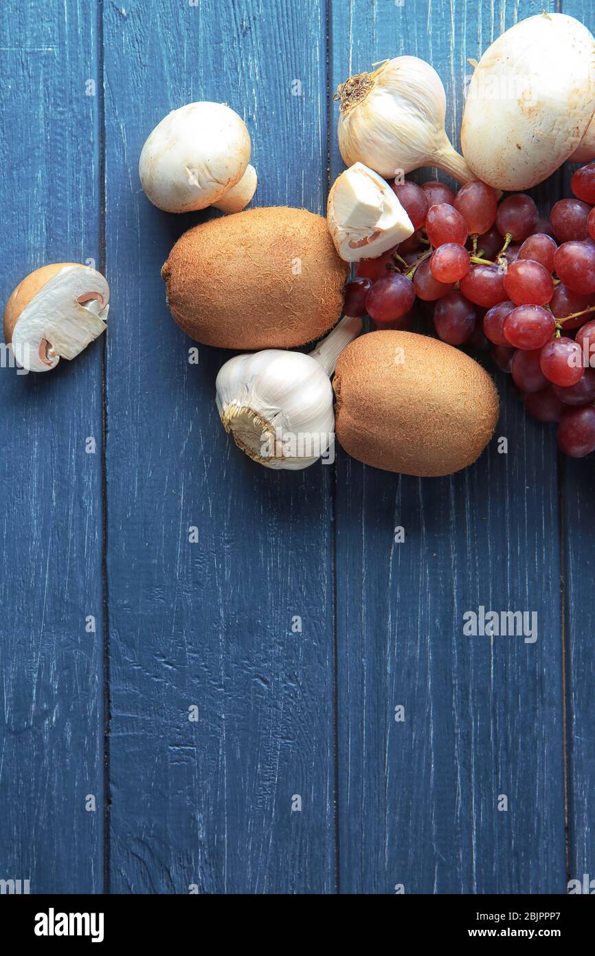 Composition of different fruits and vegetables on wooden background ...
