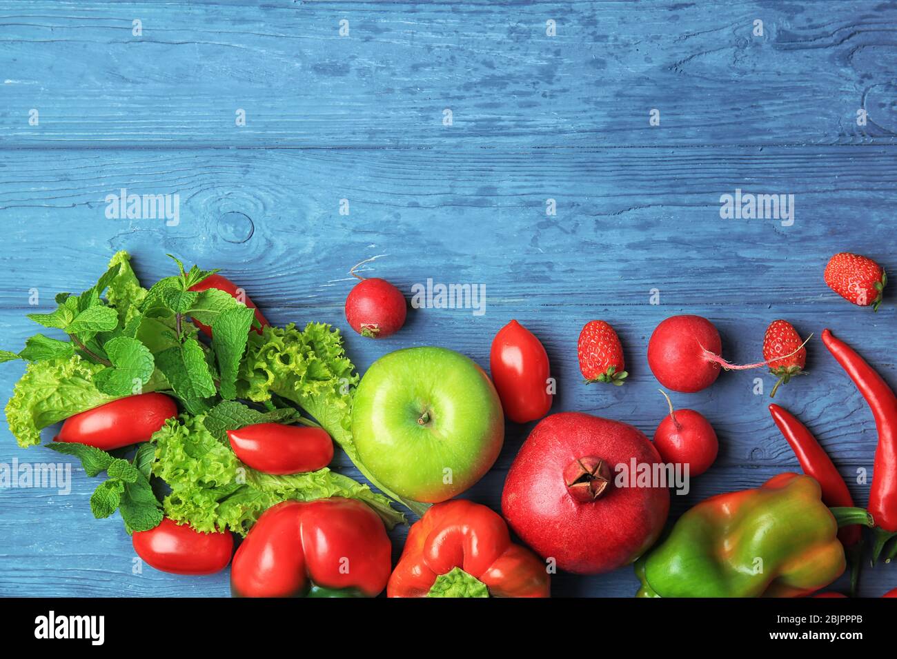 Composition of different fruits and vegetables on wooden background ...