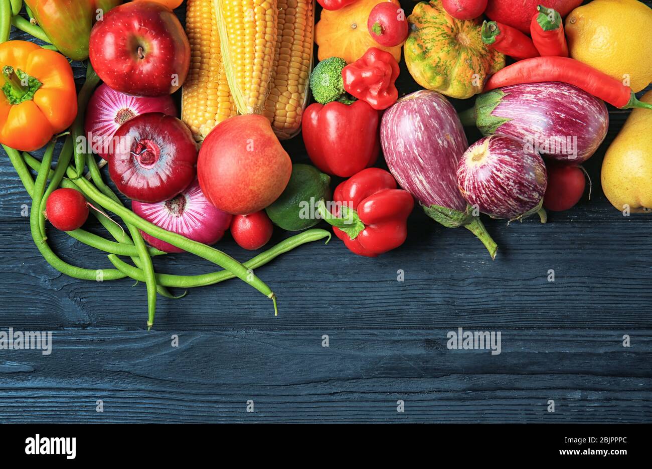 Composition of different fruits and vegetables on wooden background ...