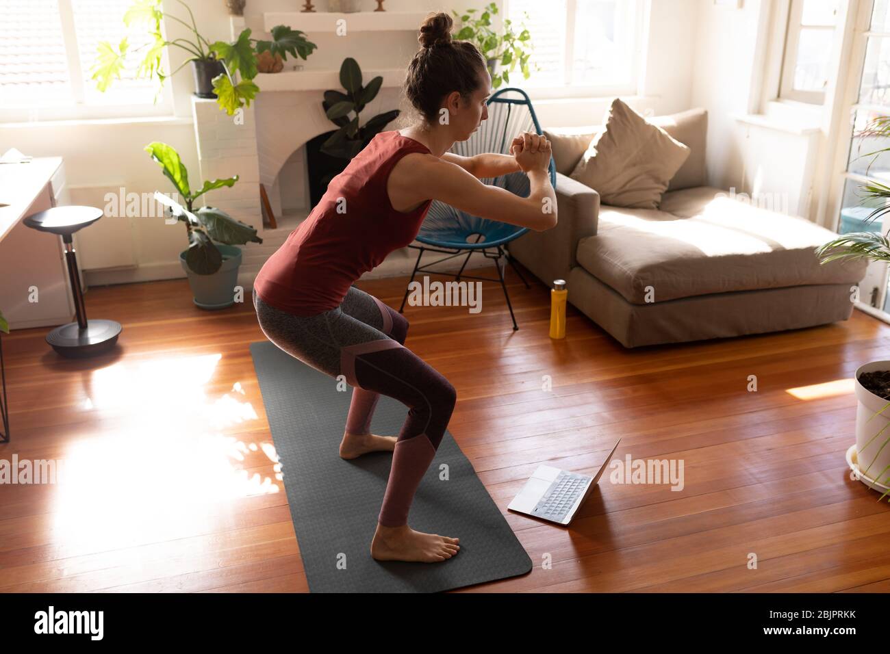 Caucasian woman self isolating doing sport during coronavirus covid19 ...