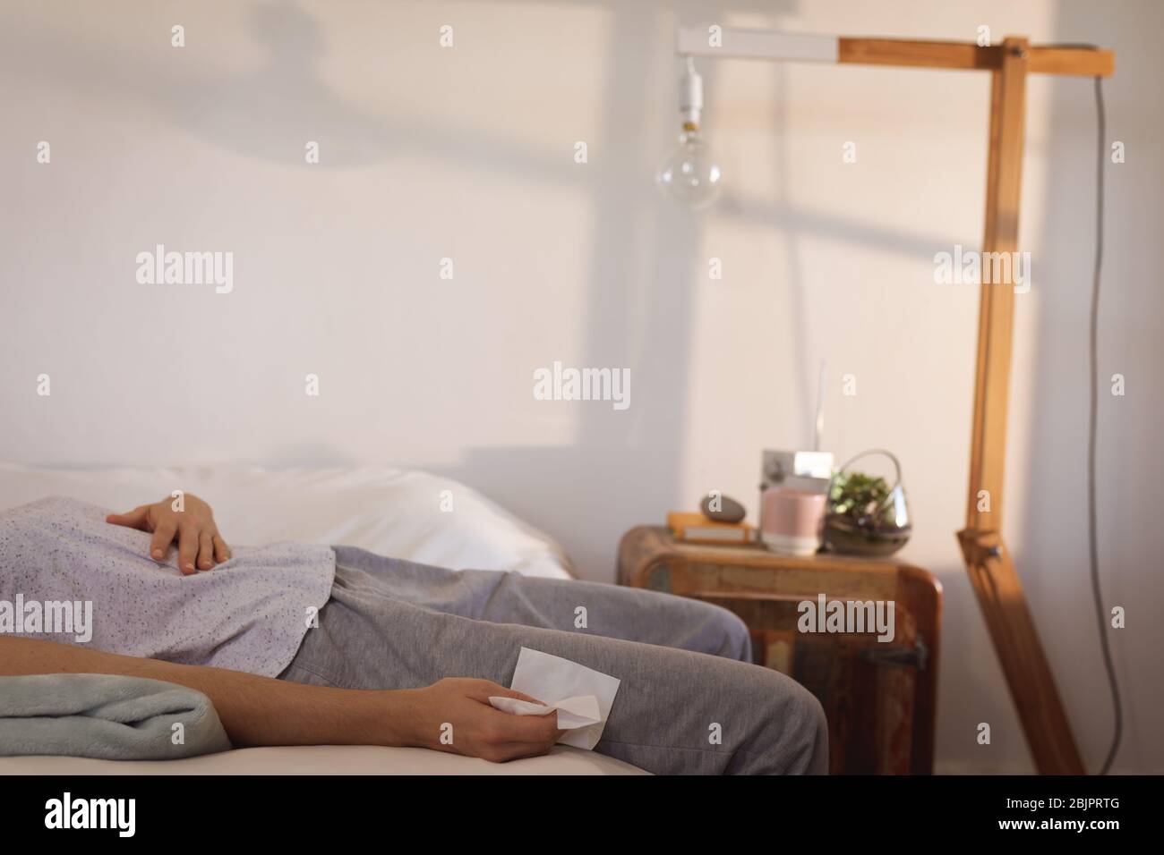 Sick Caucasian woman self isolating and social distancing in quarantine ...