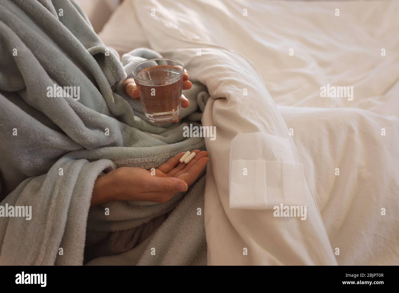 Sick Caucasian woman self isolating and social distancing in quarantine ...