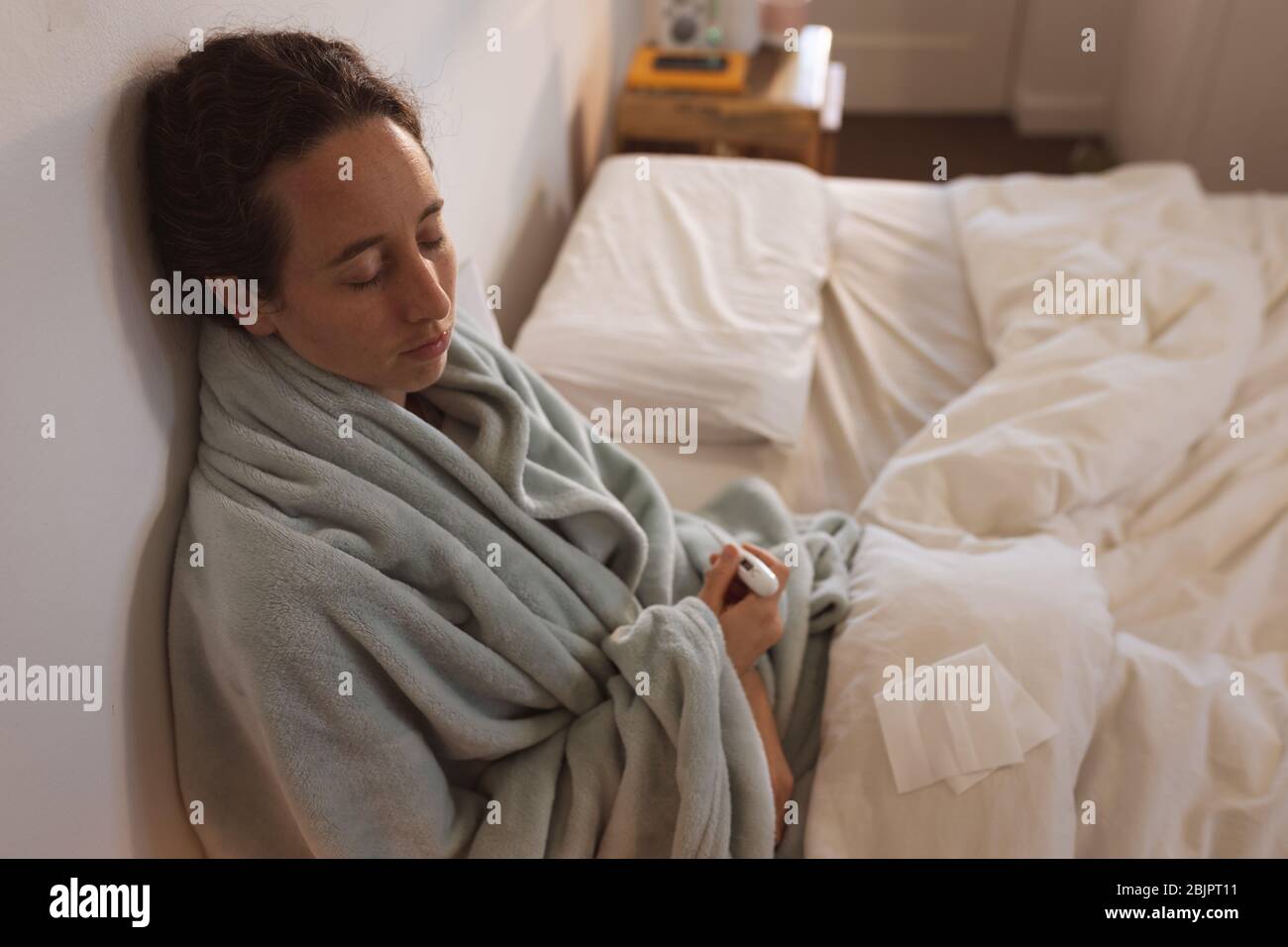 Sick Caucasian woman self isolating and social distancing in quarantine ...