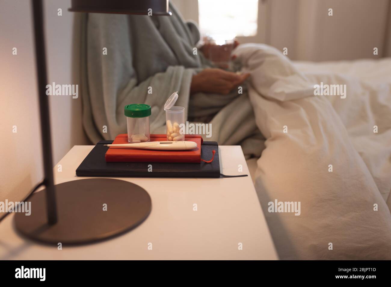 Sick Caucasian woman self isolating and social distancing in quarantine ...