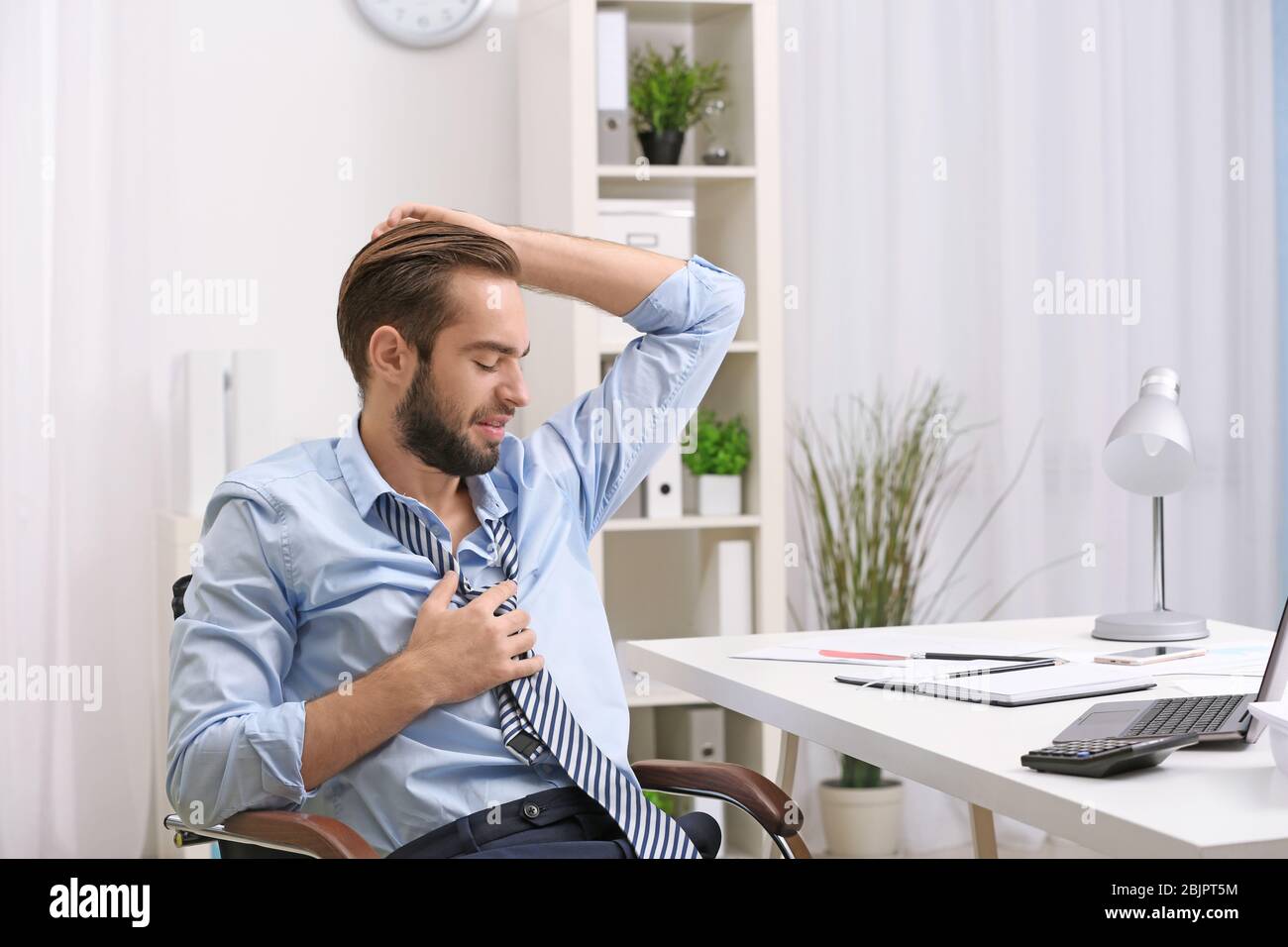 Sweating office hi-res stock photography and images - Alamy