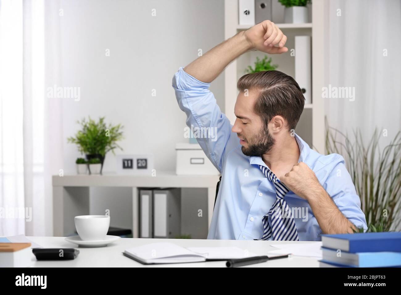 Sweating office hi-res stock photography and images - Alamy