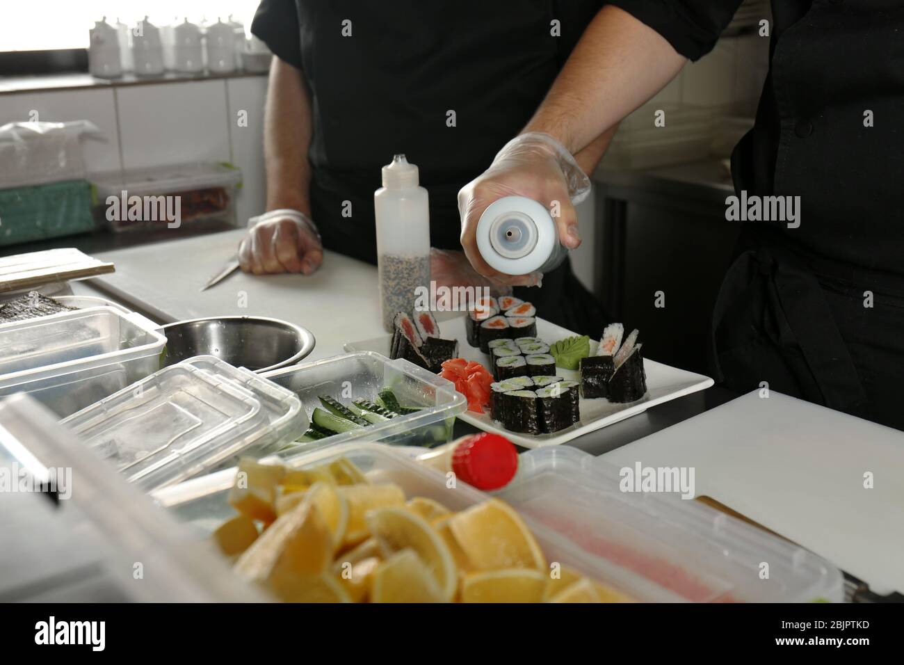 Chef making tasty maki rolls in restaurant Stock Photo - Alamy