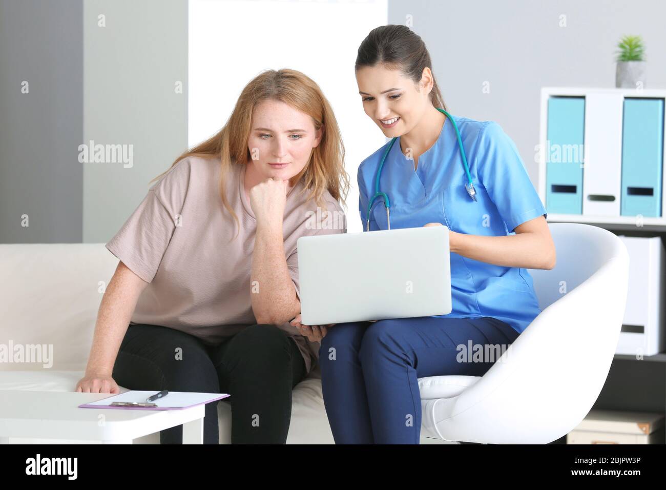 Overweight female doctor hi-res stock photography and images - Alamy