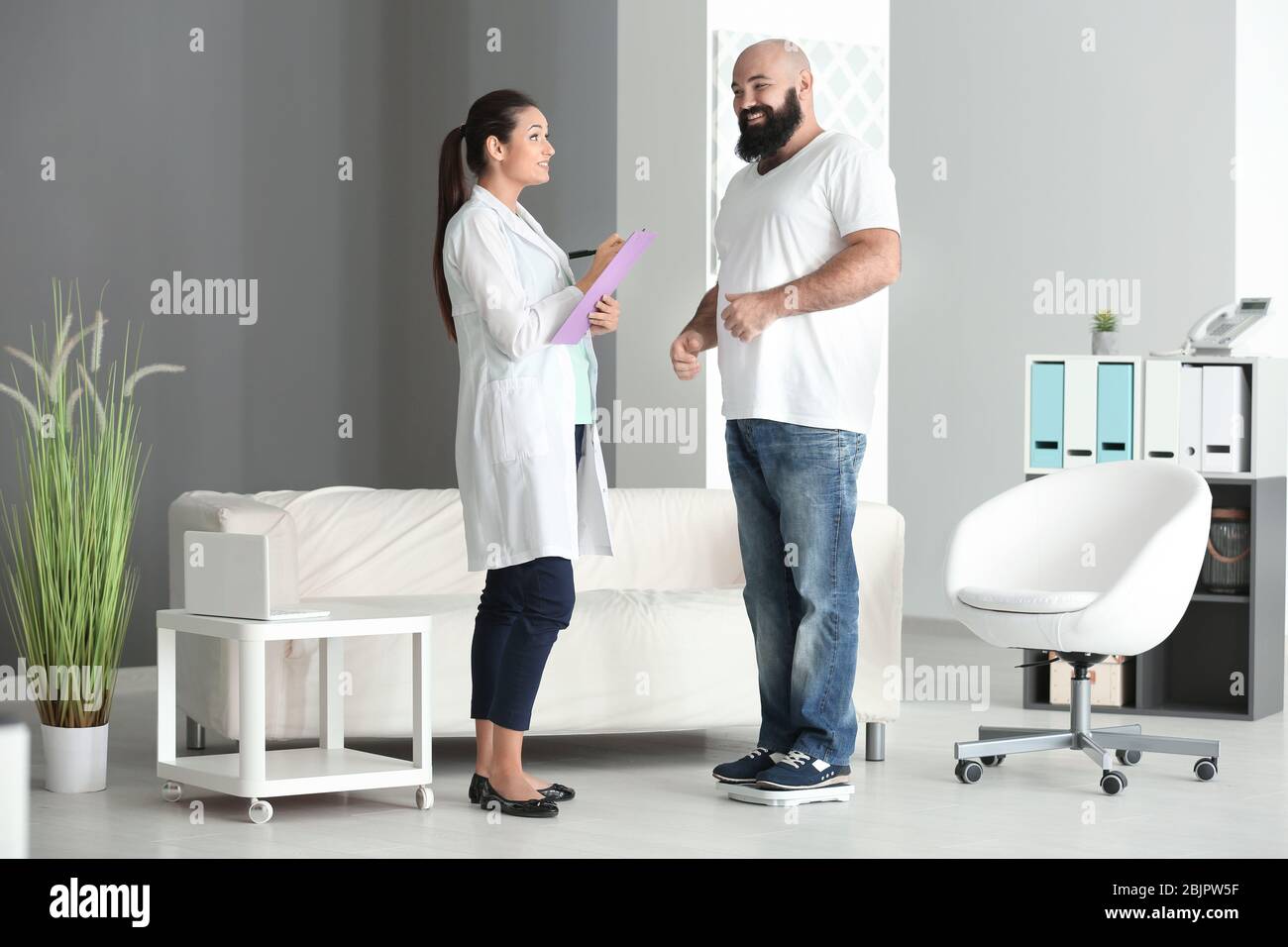 Young fat man big measuring hi-res stock photography and images - Alamy