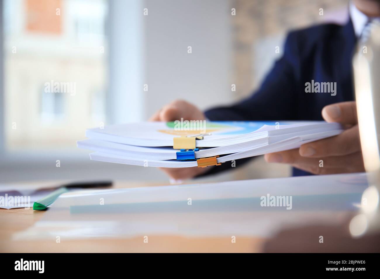 Businessman holding documents hi-res stock photography and images - Alamy