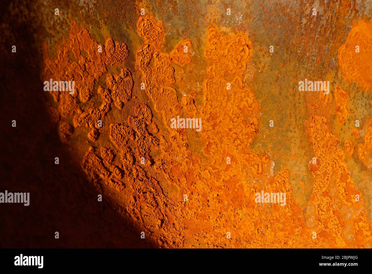 Rust (iron oxide): the sunlit interior of a cement mixer drum Stock ...