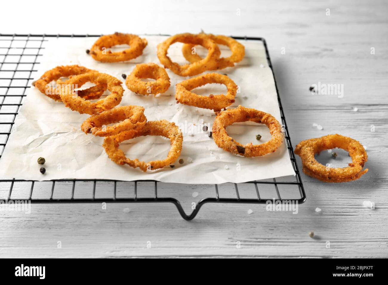 Fried onion rings on cooling rack Stock Photo - Alamy